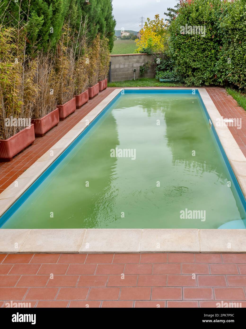 Following shock chlorination, the water in a swimming pool is white and ...