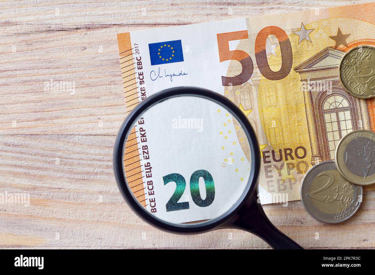 Inflation concept. Decrease in value of money, euro banknote under ...