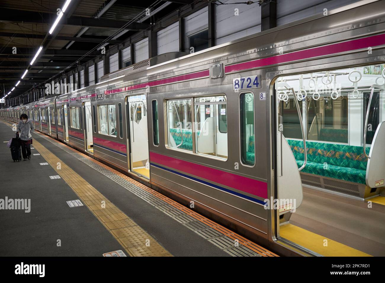 Keio train at station in the night Stock Photo - Alamy