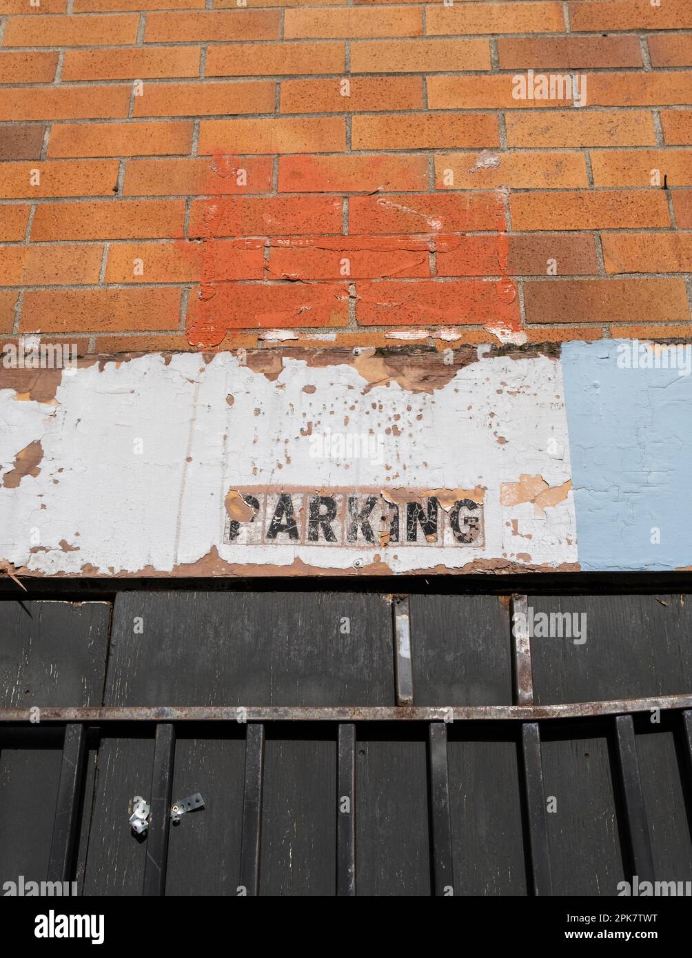 An old PARKING sign on a building wall Stock Photo - Alamy