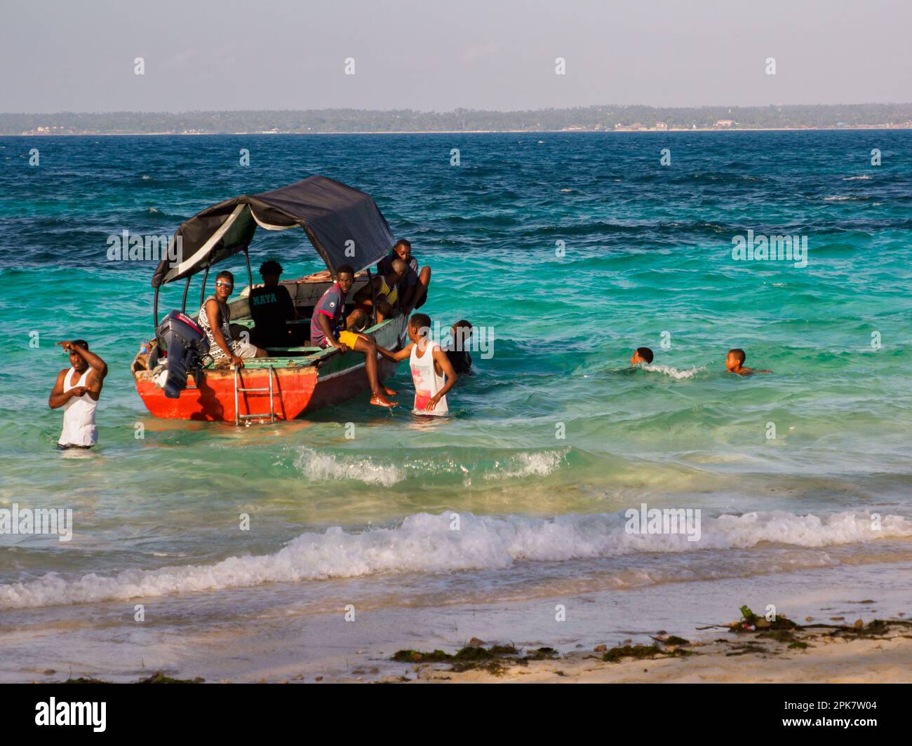 Zanzibar, Tanzania - Jan, 2021: Boat with group of African men mooring ...