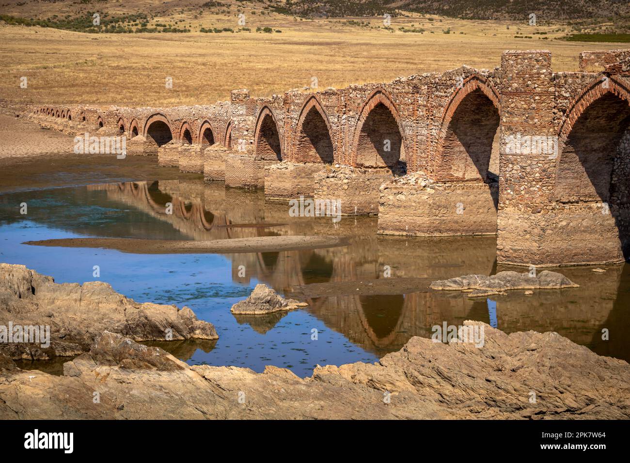 La Mesta bridge of medieval construction over the Guadiana river in the ...