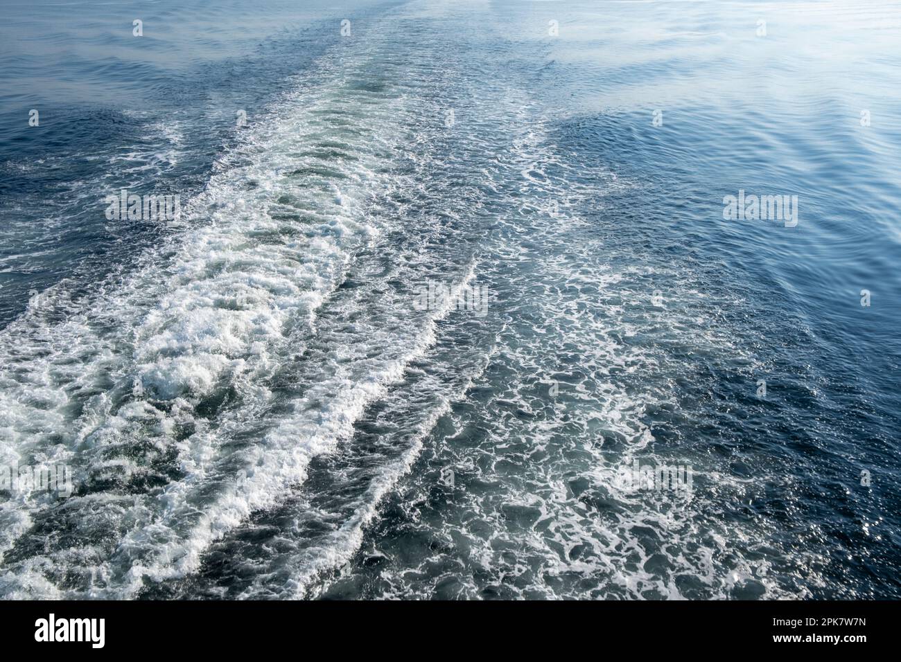 The wake from a ferry boat, foam and ripples on the ocean Stock Photo ...
