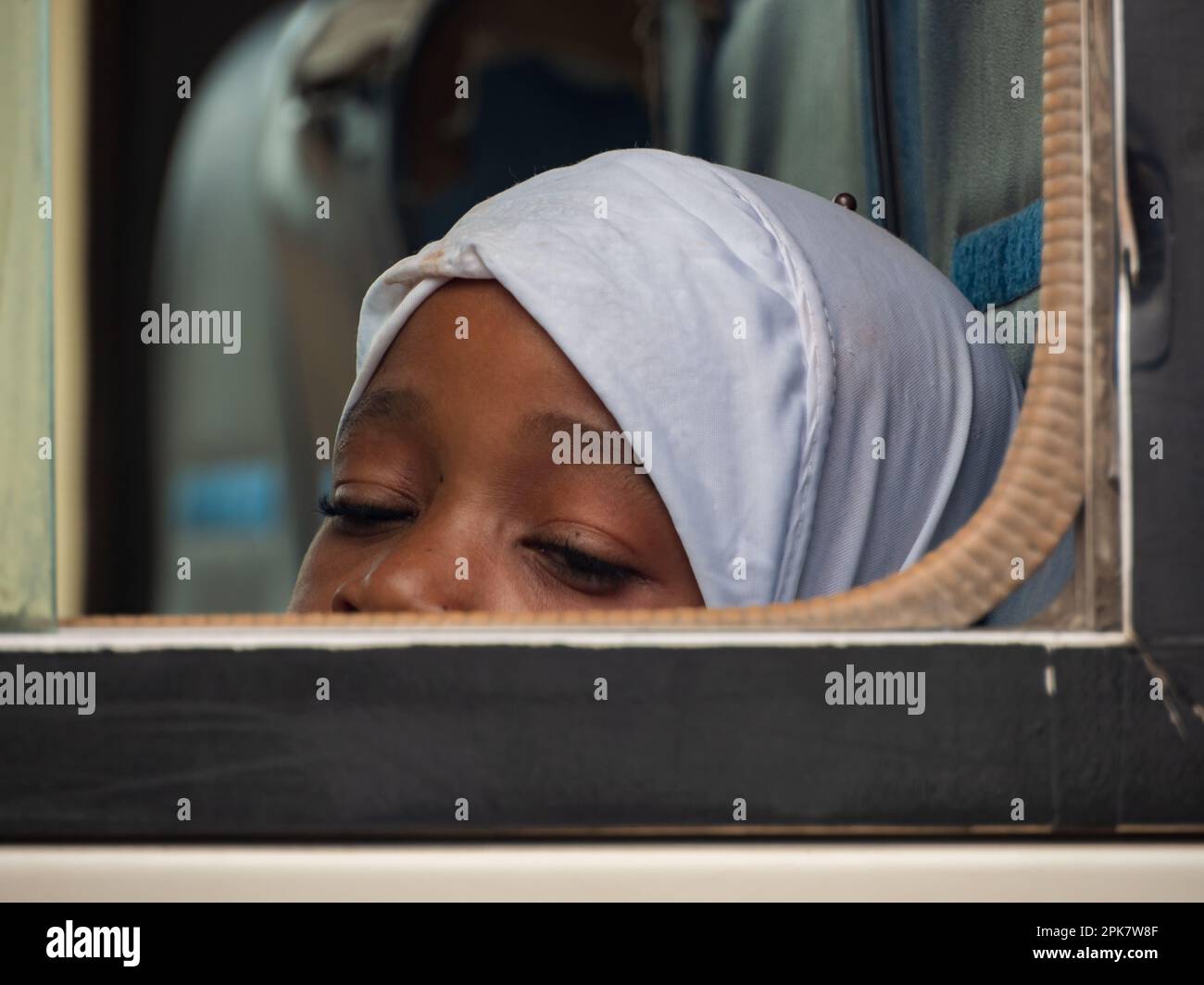 Zanzibar, Tanzania- Jan, 2021: African girl in the bus coming back from ...