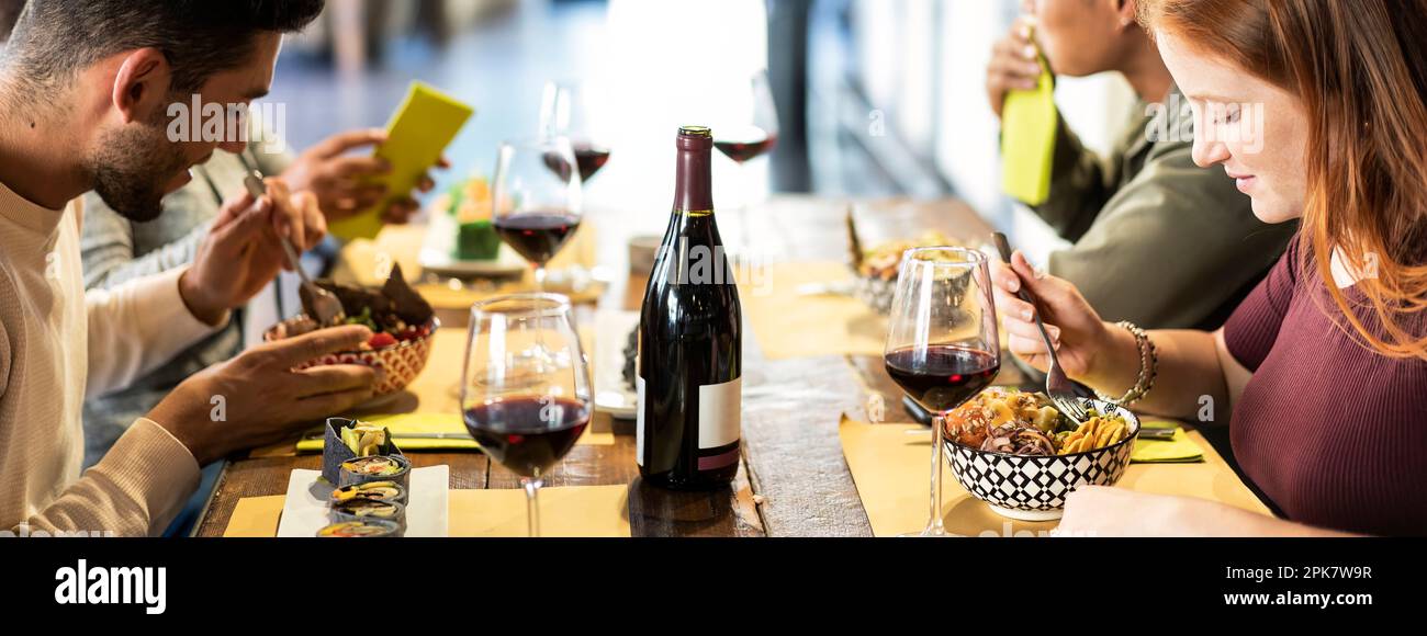 Horizontal banner or header with multiracial friends eating poke bowl ...