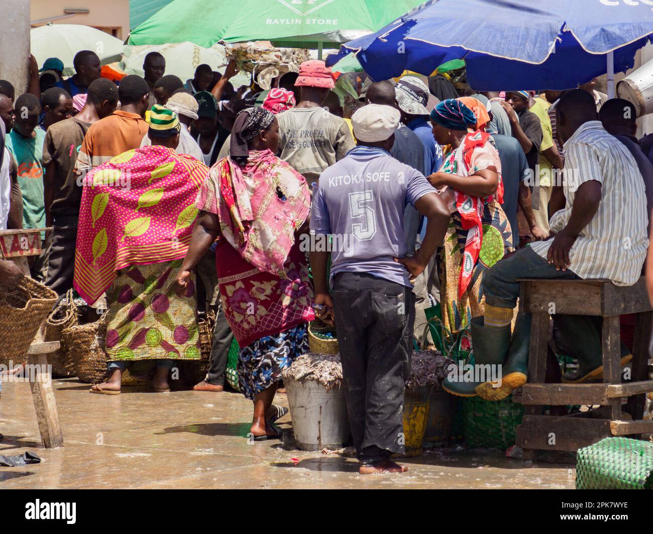 Dar es Salaam, Tanzania - February 2021: A crowd of African fishermen ...