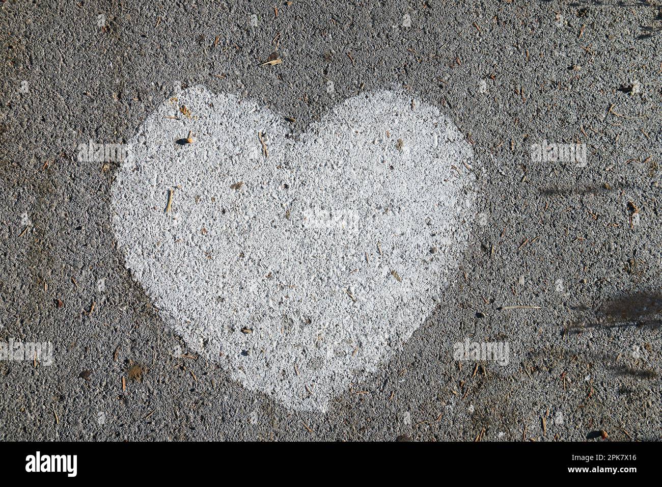 A white heart painted on the ground Stock Photo - Alamy
