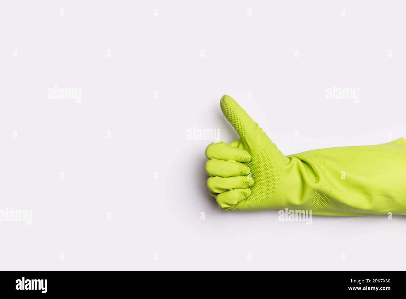 Hand in Green Latex Glove Giving Thumbs Up Sign. Like. White background ...