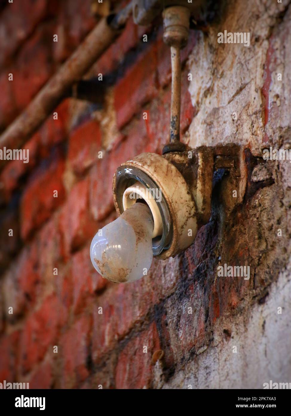 Old grungy lightbulb with broken fitting, making it look sad Stock ...