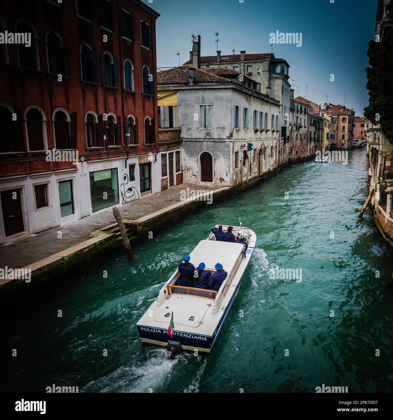 Police patrol launch on Venetian canal Rio de Ca' Foscari, Dorsoduro ...