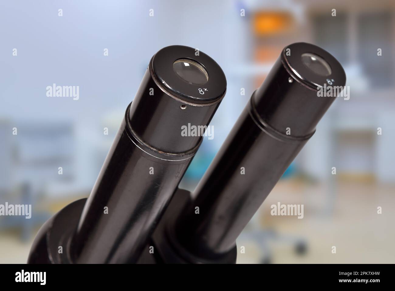old microscope on a laboratory background Stock Photo - Alamy