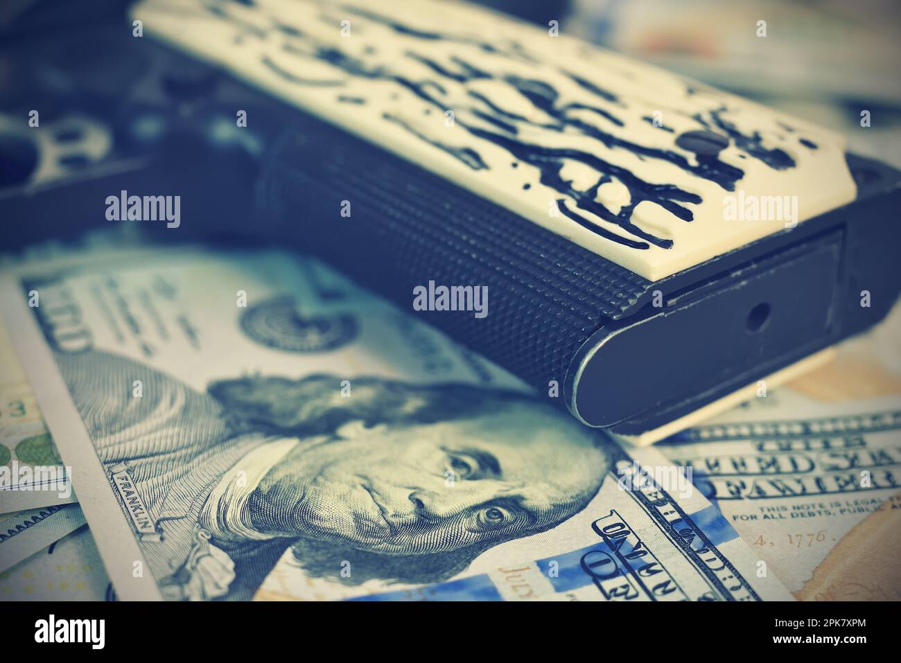 Gun grip and dollar bills. Vintage effect Stock Photo - Alamy