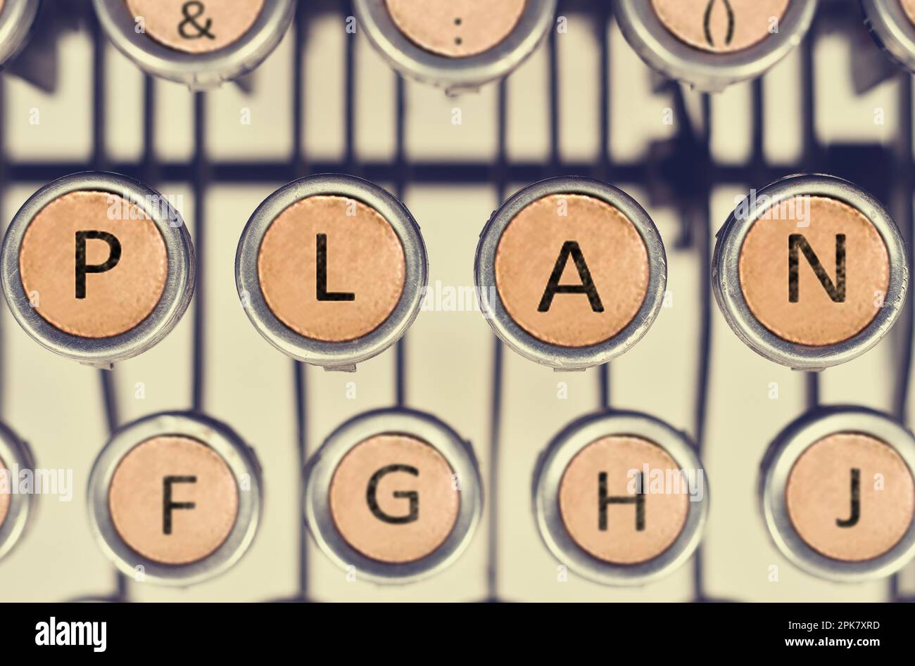 Plan in old round typewriter keys, close up Stock Photo - Alamy