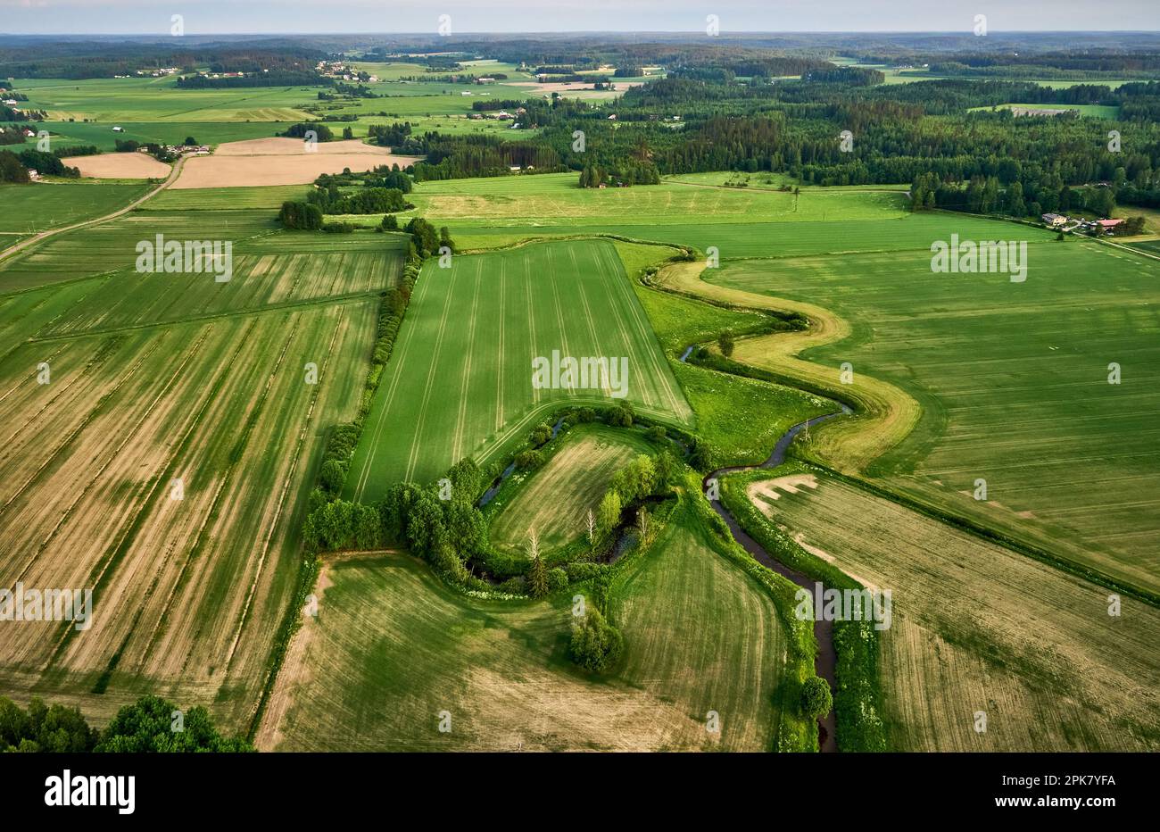 An aerial view of the vast rolling hills of rural farmland with lush ...