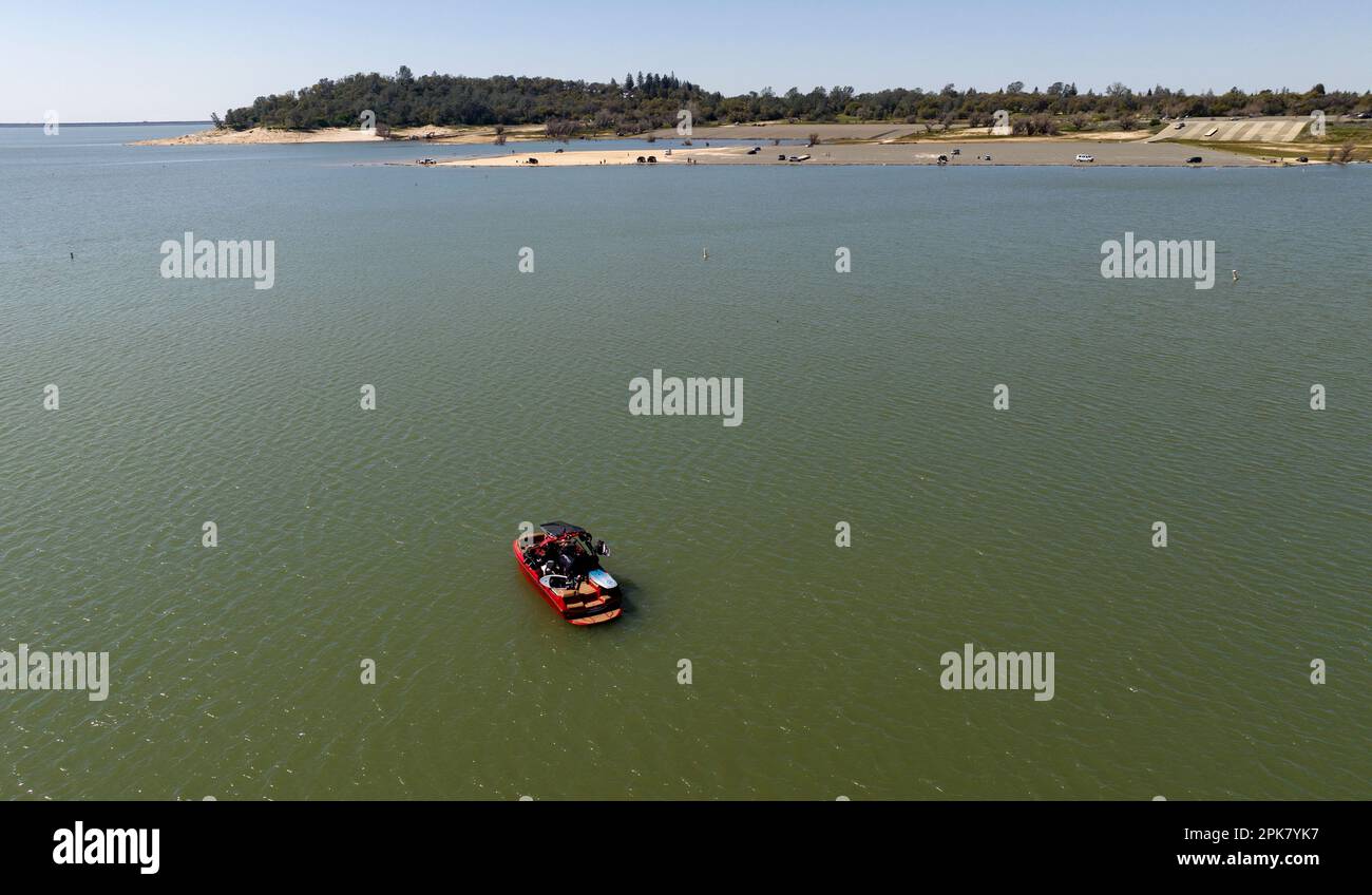 In an aerial view, a boat floats in the Granite Bay area of Folsom Lake ...