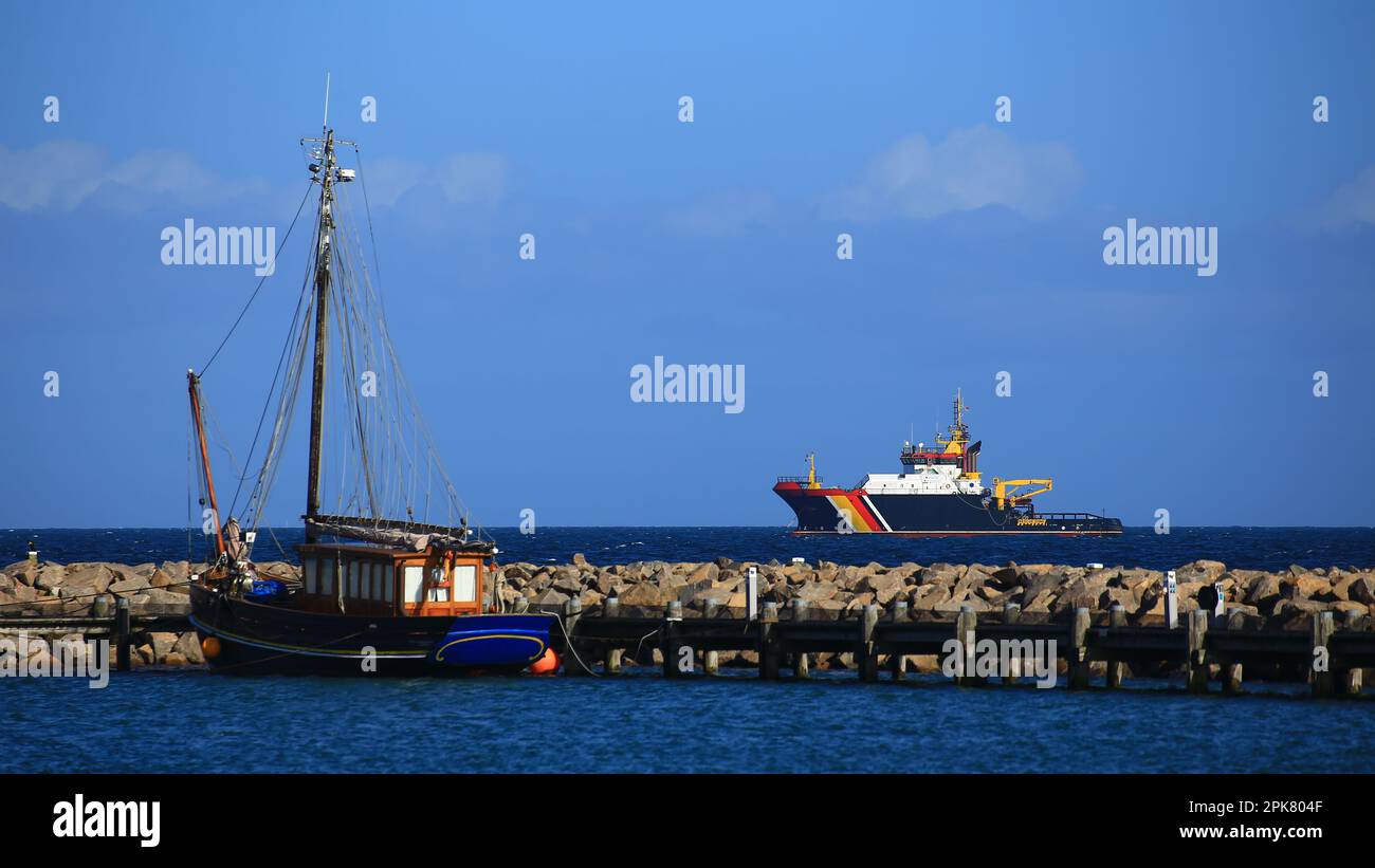 View over harbor basin in northern Germany with small sailboat and ...
