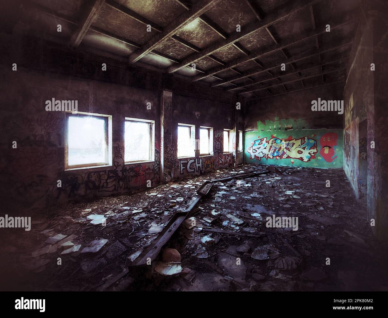 Grungy shot of ruined factory room full of trash Stock Photo - Alamy