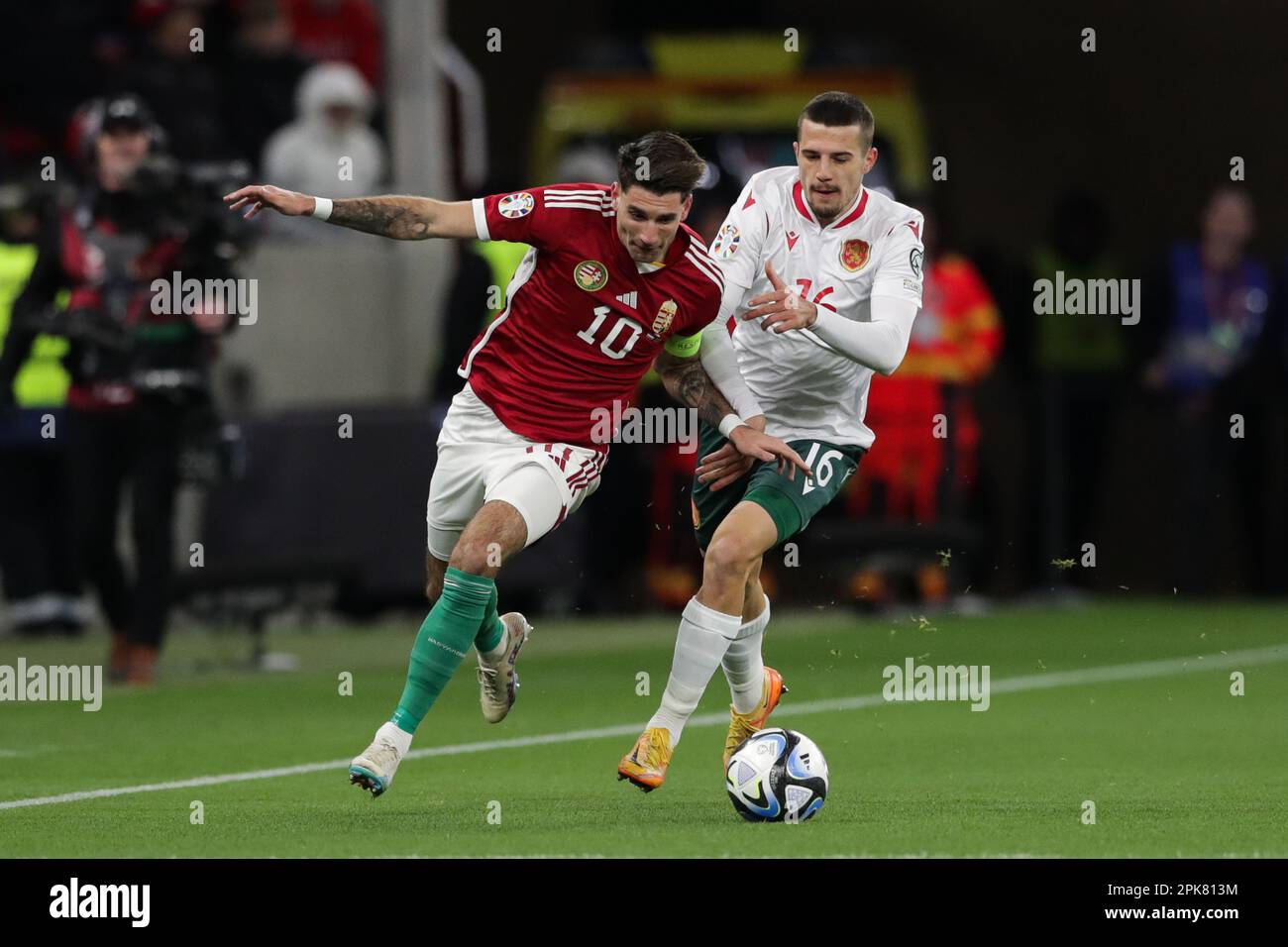 Budapest, Hungary. 27th Mar, 2023. Dominik Szoboszlai of Hungary (L ...