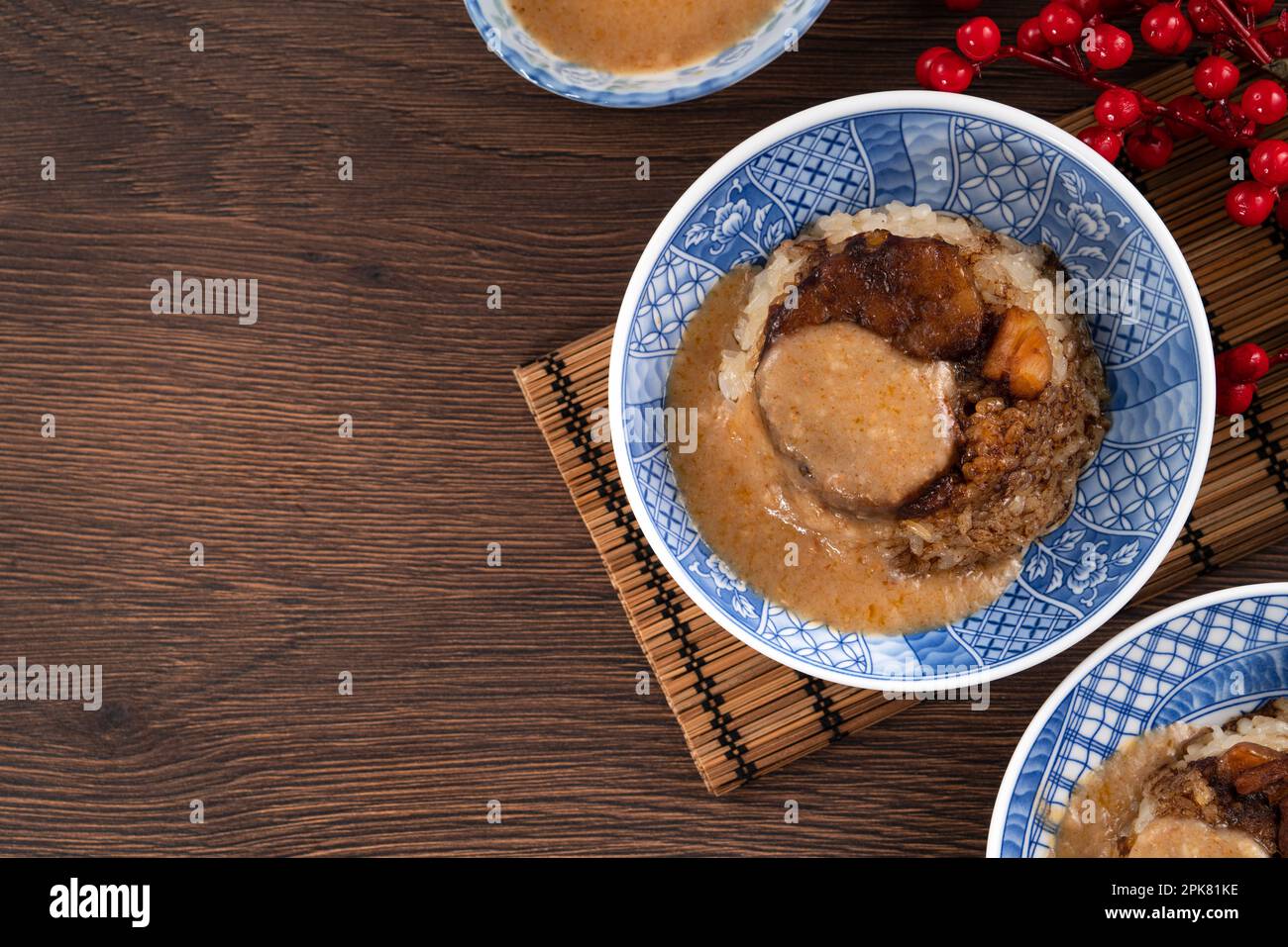 Migao, tube rice cake, rice pudding in a bowl topped with minced pork ...