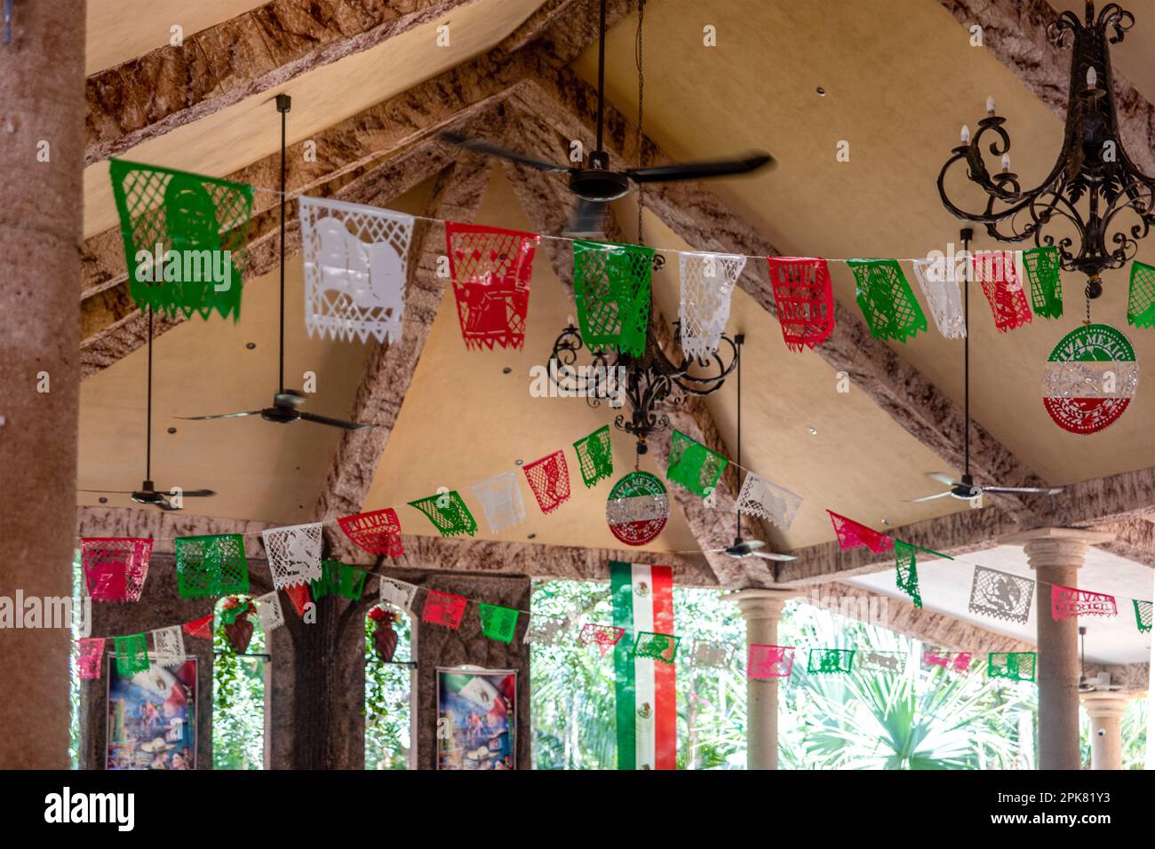 Roof of a Mexican open terrace with flags and typical decoration of ...