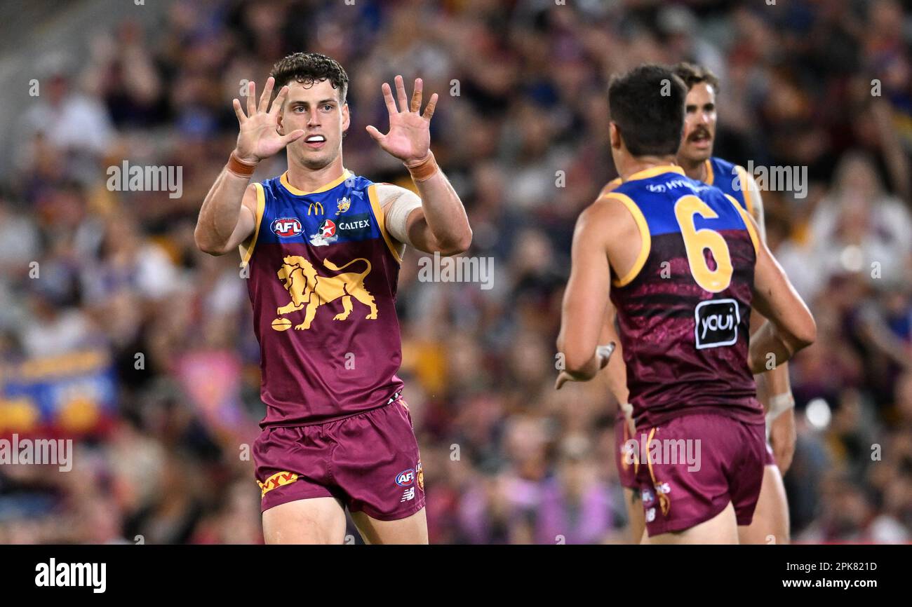 Jarrod Berry (left) of the Lions celebrates kicking a goal with Hugh ...