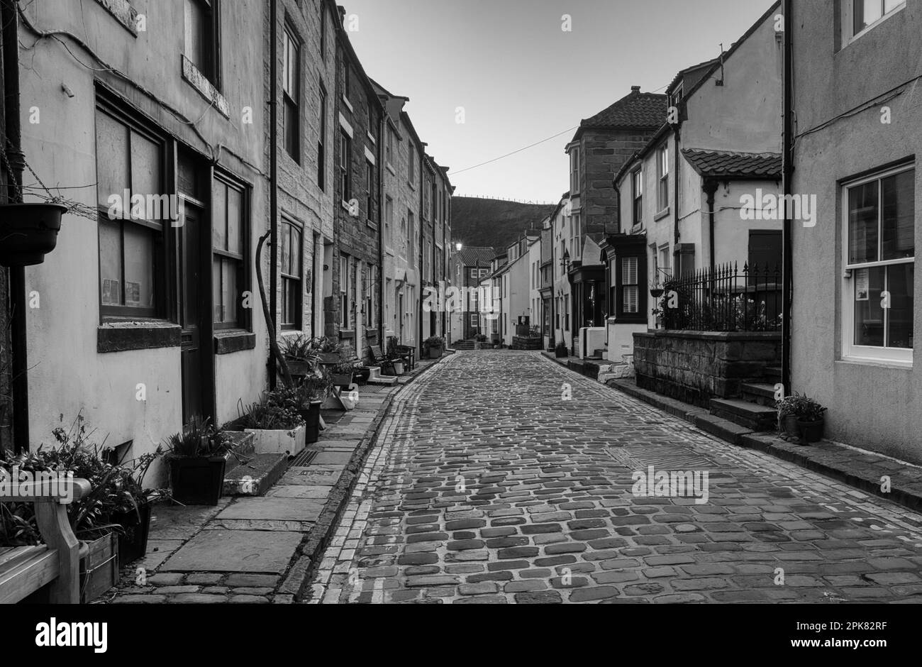 Staithes cobbled street view monochrome Stock Photo - Alamy