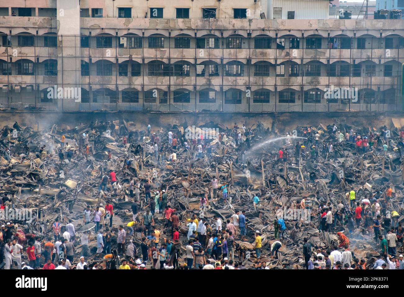 Bangladesh: 04/04/2023, Fire-fighters spray water to douse small hidden ...