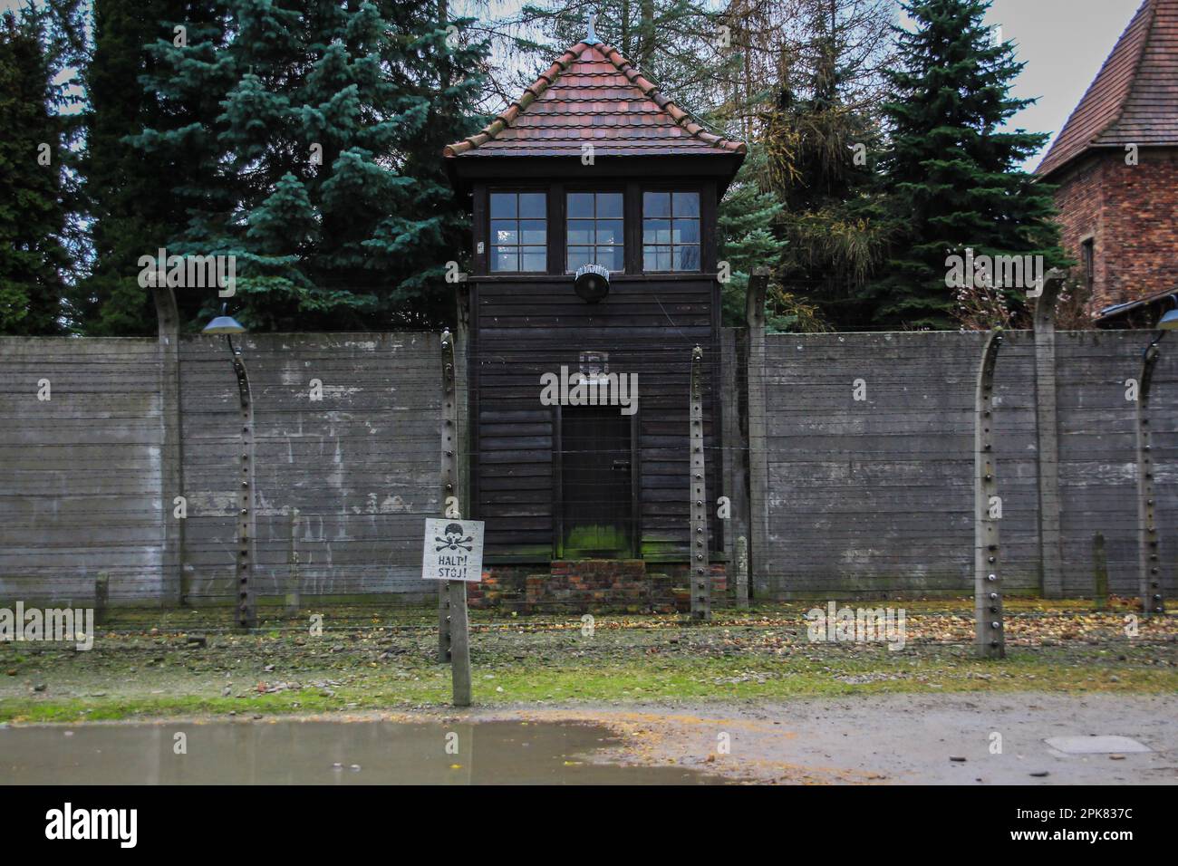 The wooden guard tower with barbed wire fencing. Auschwitz ...
