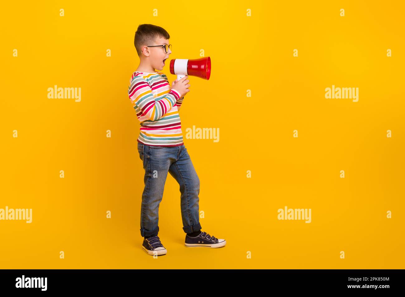 Full length profile side photo of adorable boy screaming in microphone ...