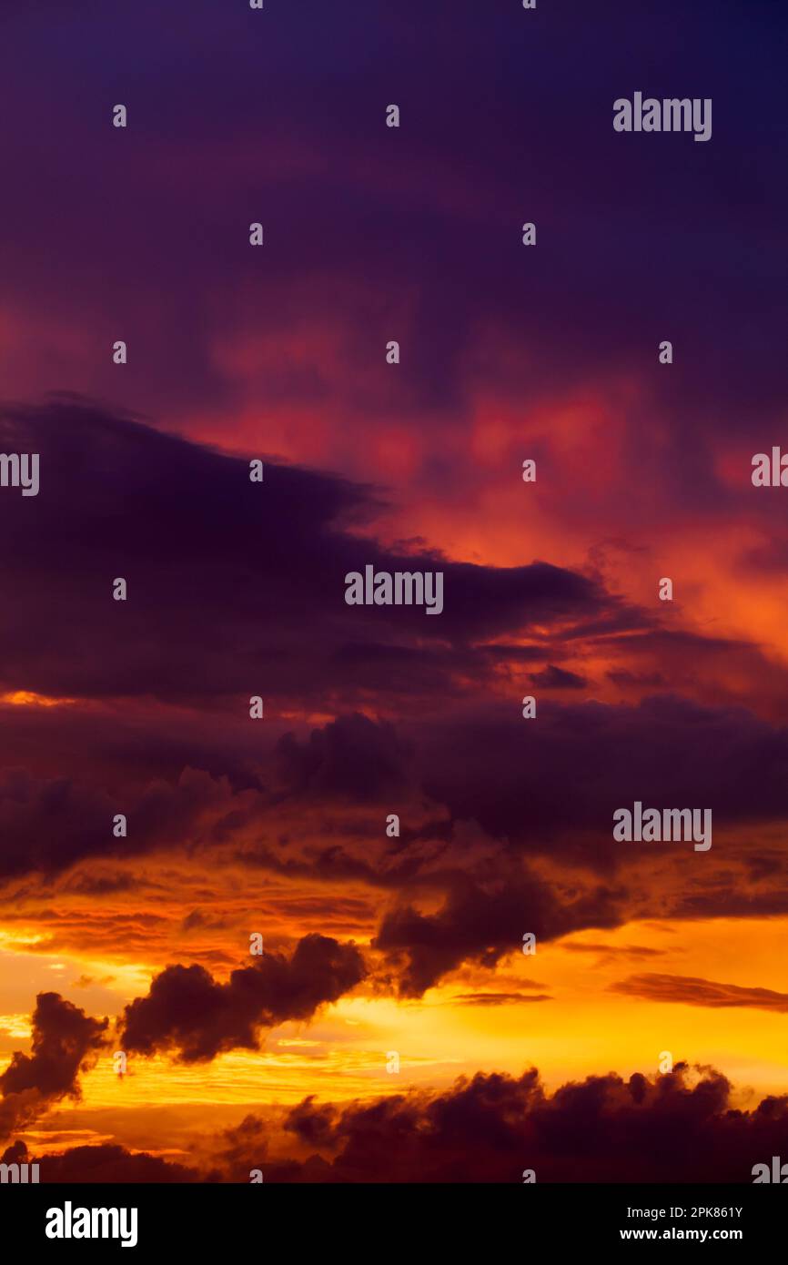 Colorful sunset sky with dark clouds, natural background, vertical ...