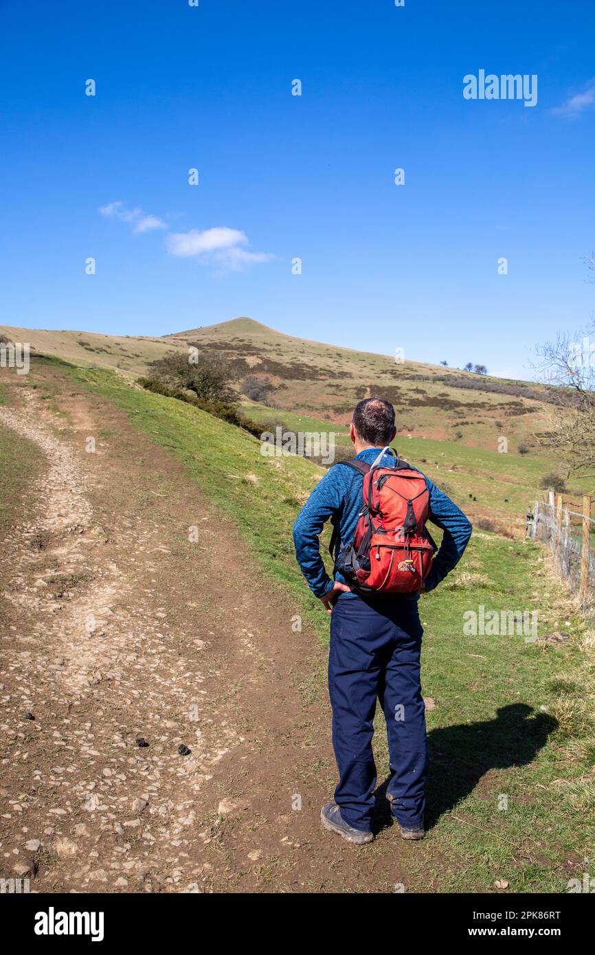 Man about to start the walk up to the summit of Lose Hill, the start of ...