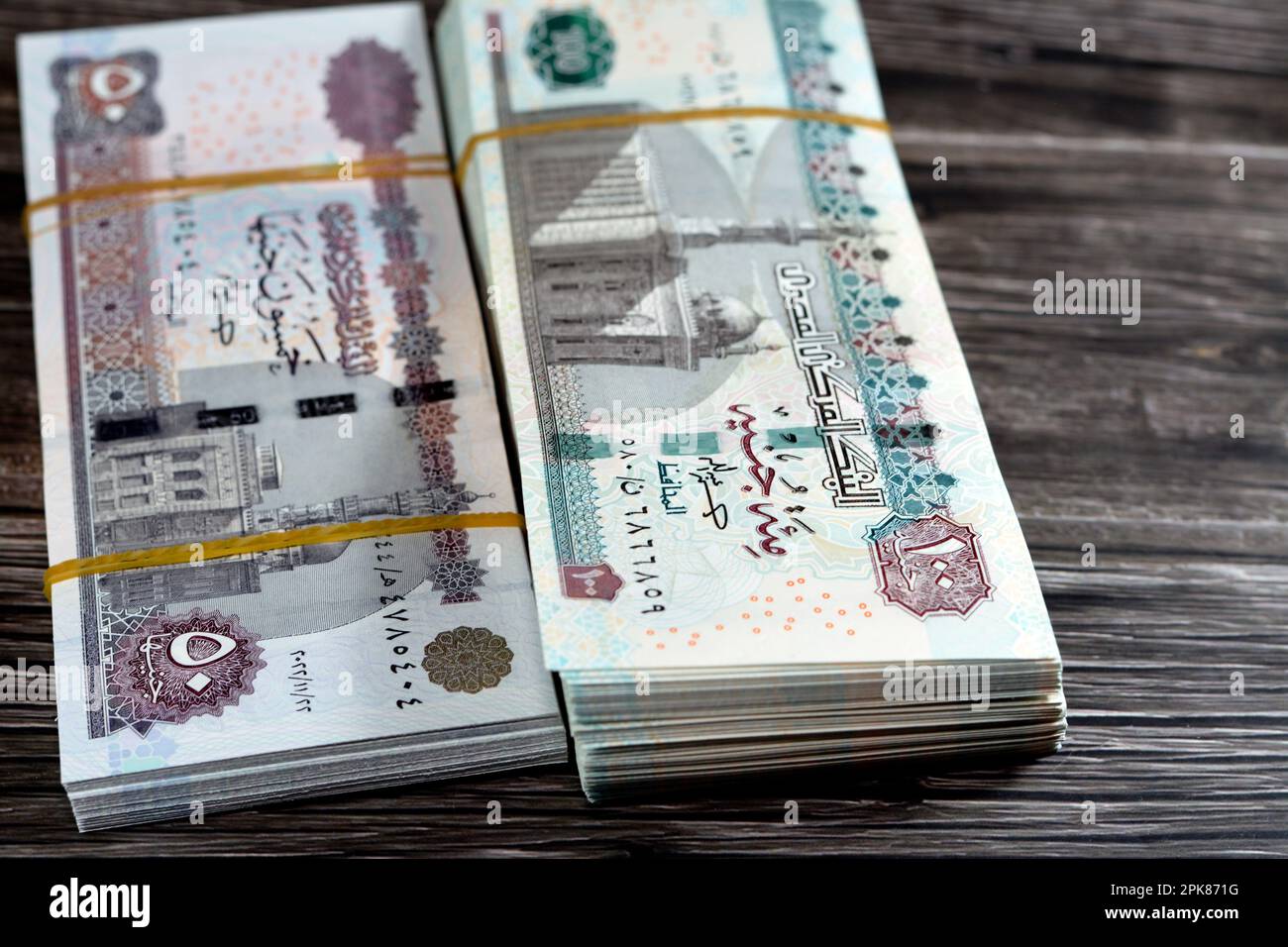 Stacks of Egypt money banknote bills of 100 and 50 EGP LE one hundred ...
