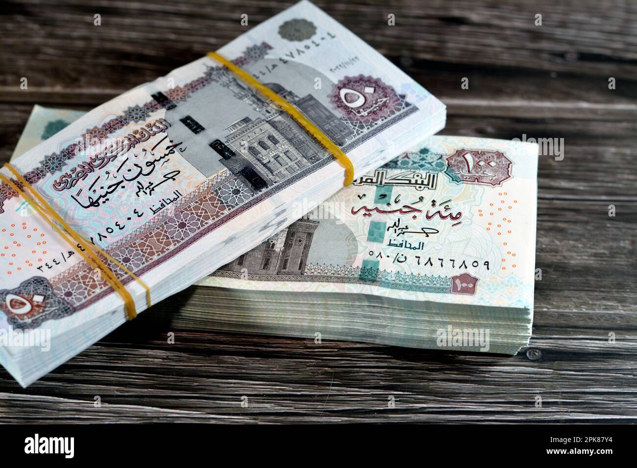 Stacks of Egypt money banknote bills of 100 and 50 EGP LE one hundred ...