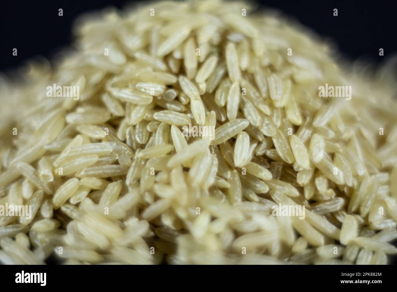 Picture of a pile of brown rice. Brown rice is a whole grain rice with ...
