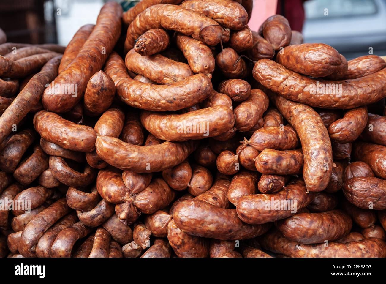 Picture of a stack and pile of smoked sausages, called carniolan ...