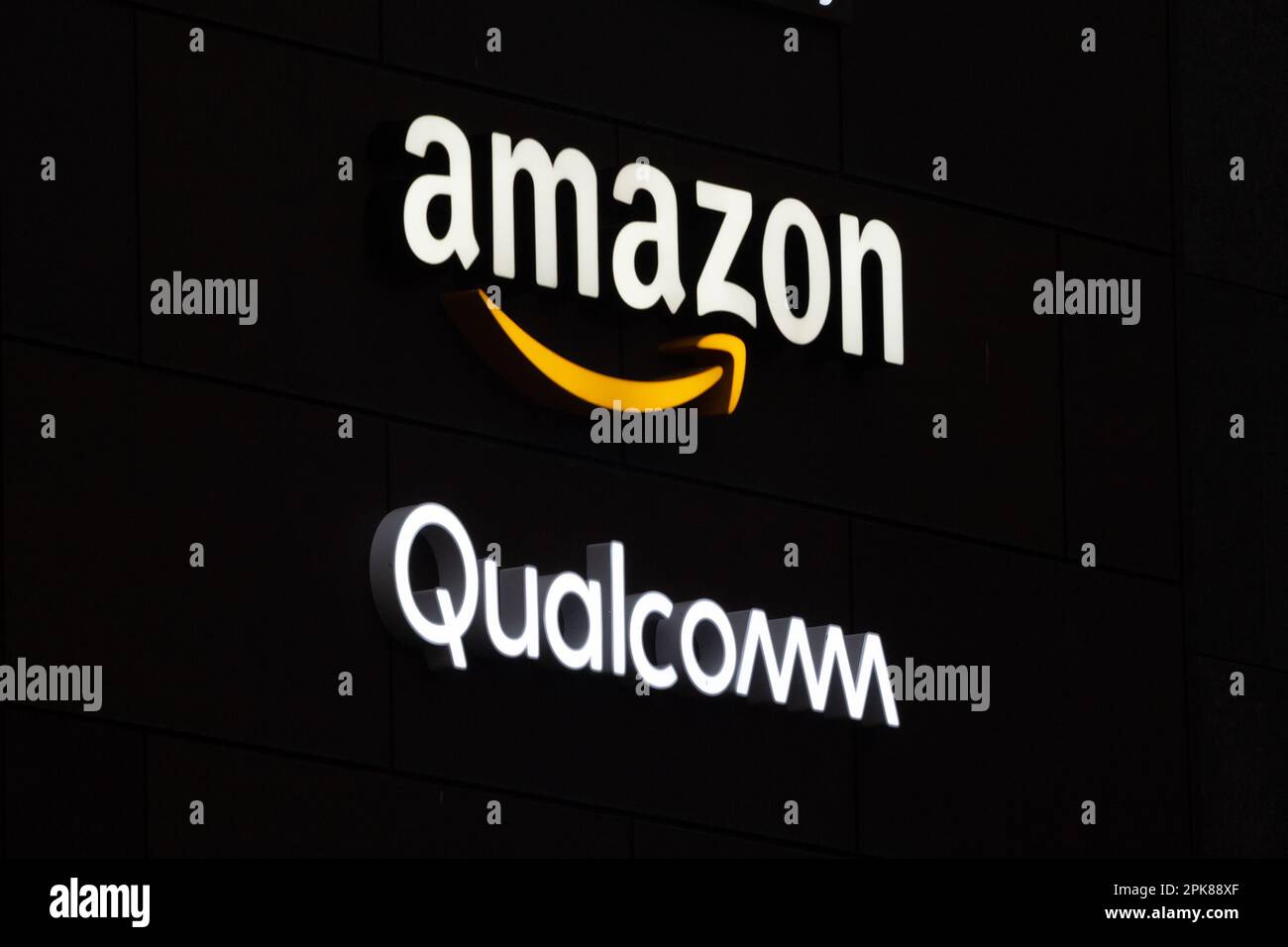 Picture of signs with the logos of Amazon and Qualcomm on their office ...