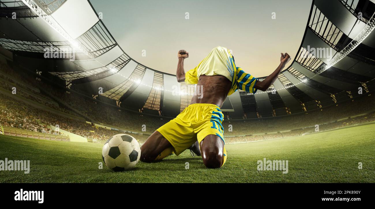Professional football player on sport football arena celebrating a goal ...