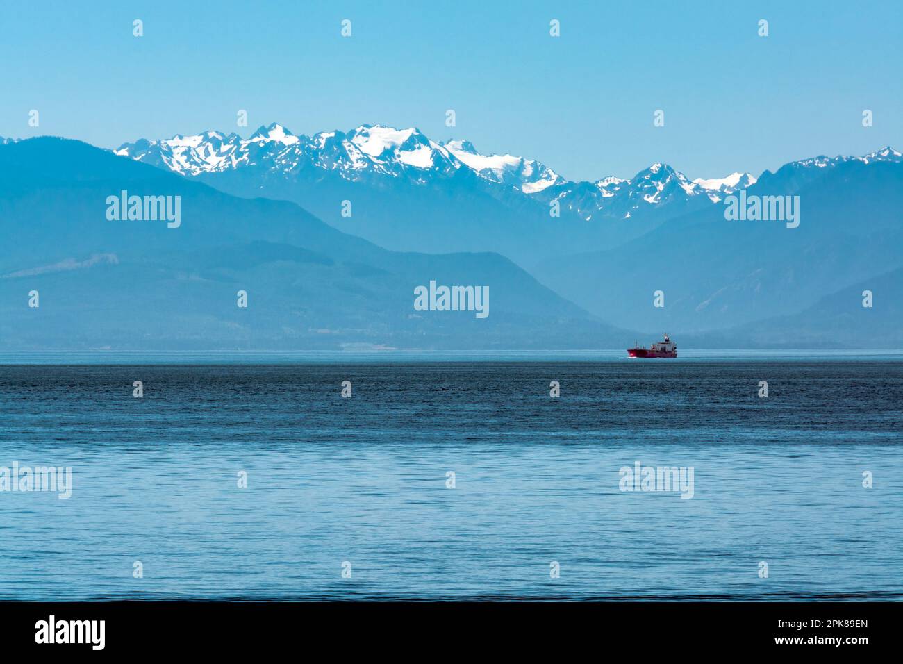 Freight vessel going over the bay on Pacific ocean at Vancouver island ...