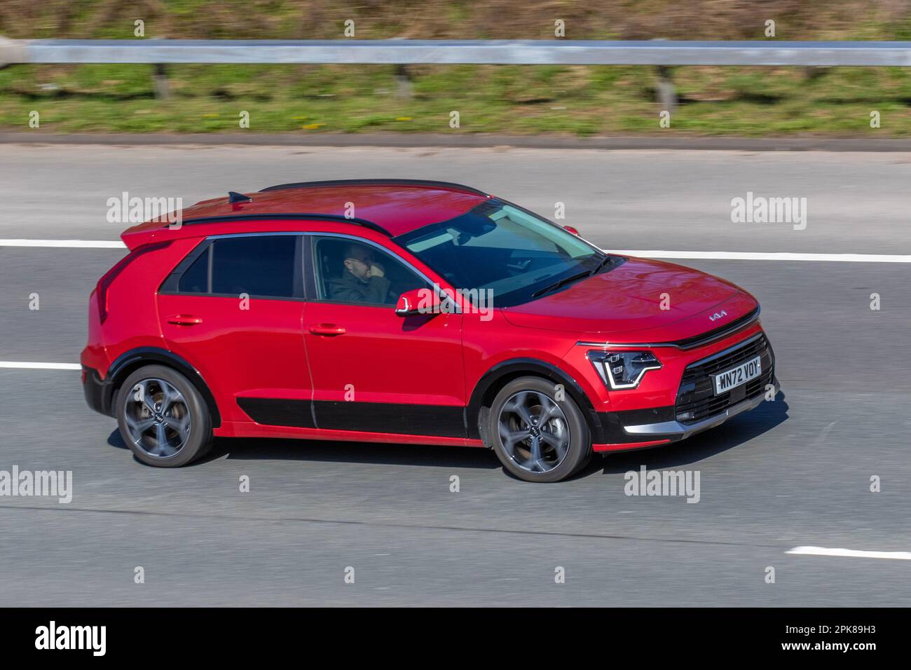 2022 Red KIA Niro 3 PHEV S-A; travelling on the M61 motorway, UK Stock ...