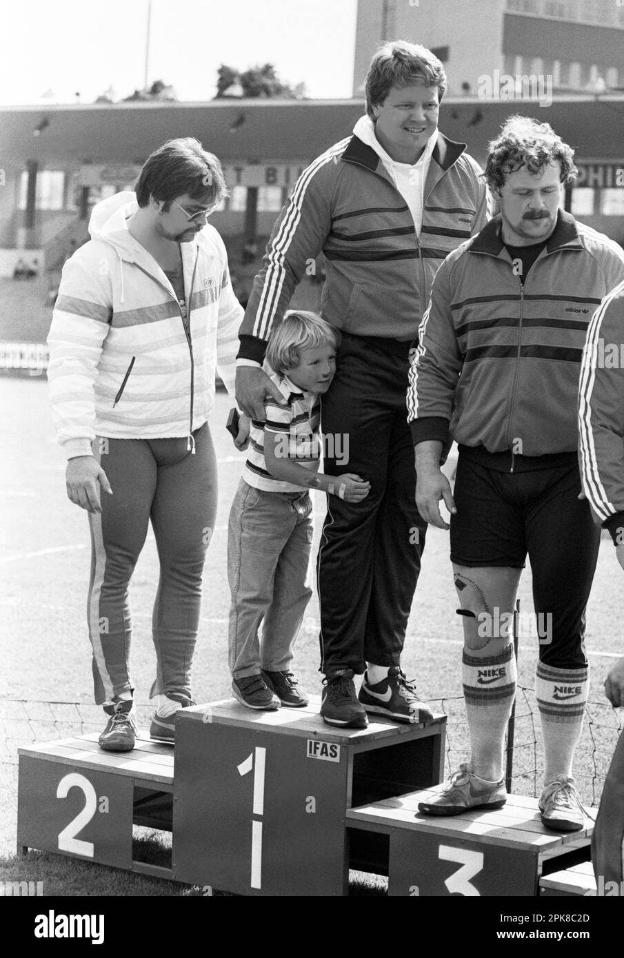 KNUT HJELTNES Norway on podium with his son after victory in the shot ...