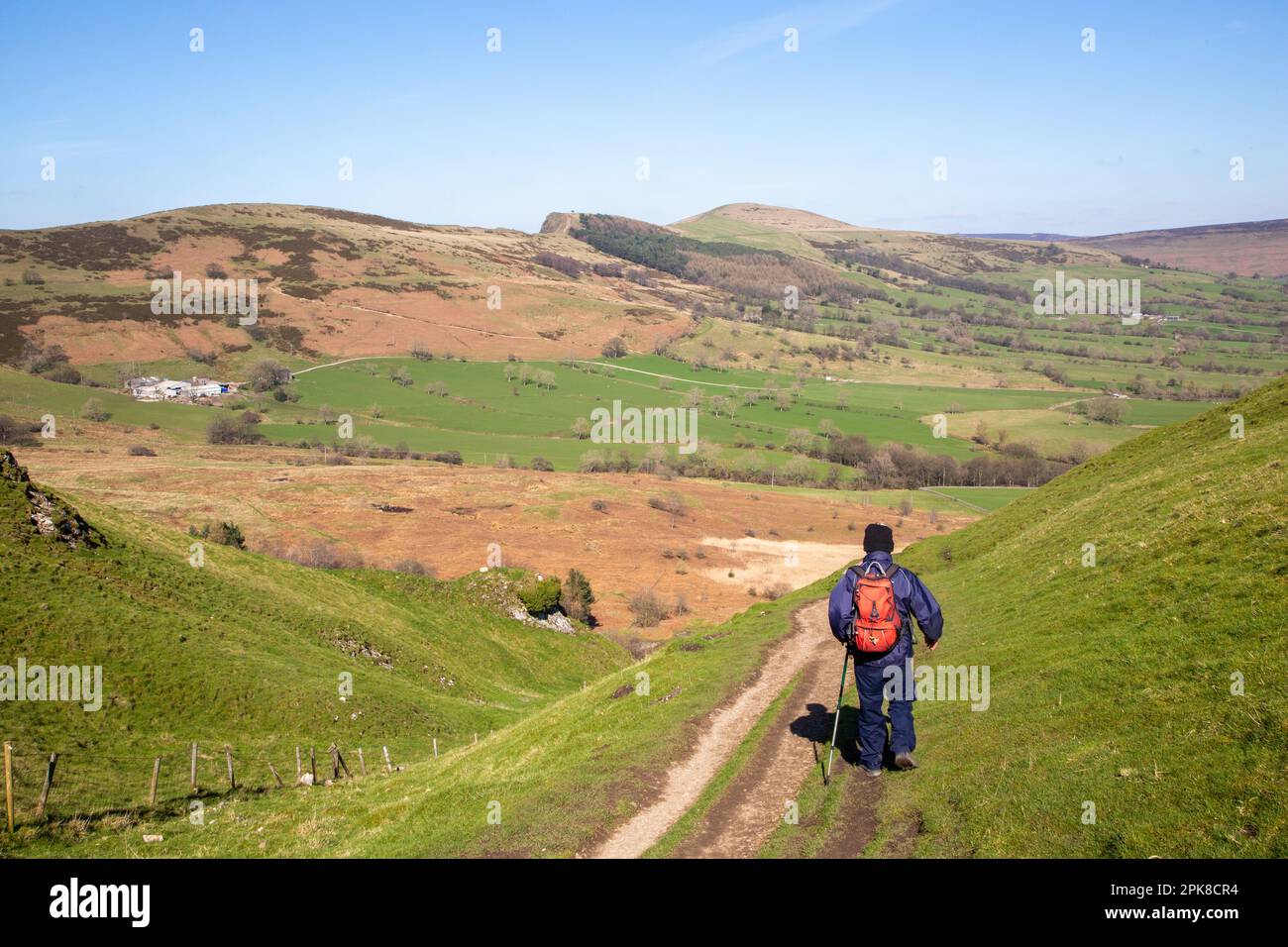 Man backpacking hill walking in the English Peak District above the ...