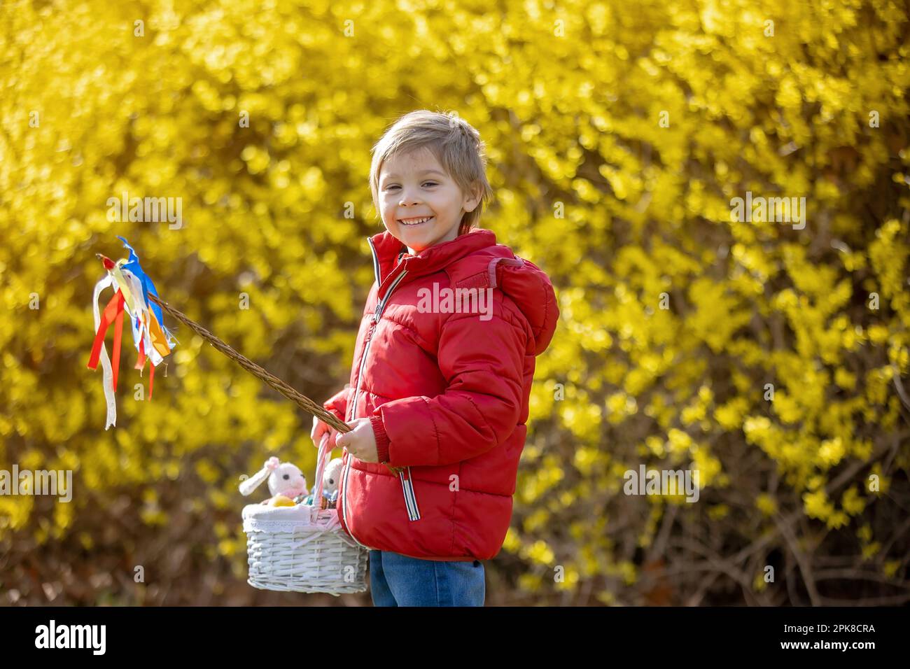 Cute preschool child, boy, holding handmade braided whip made from ...