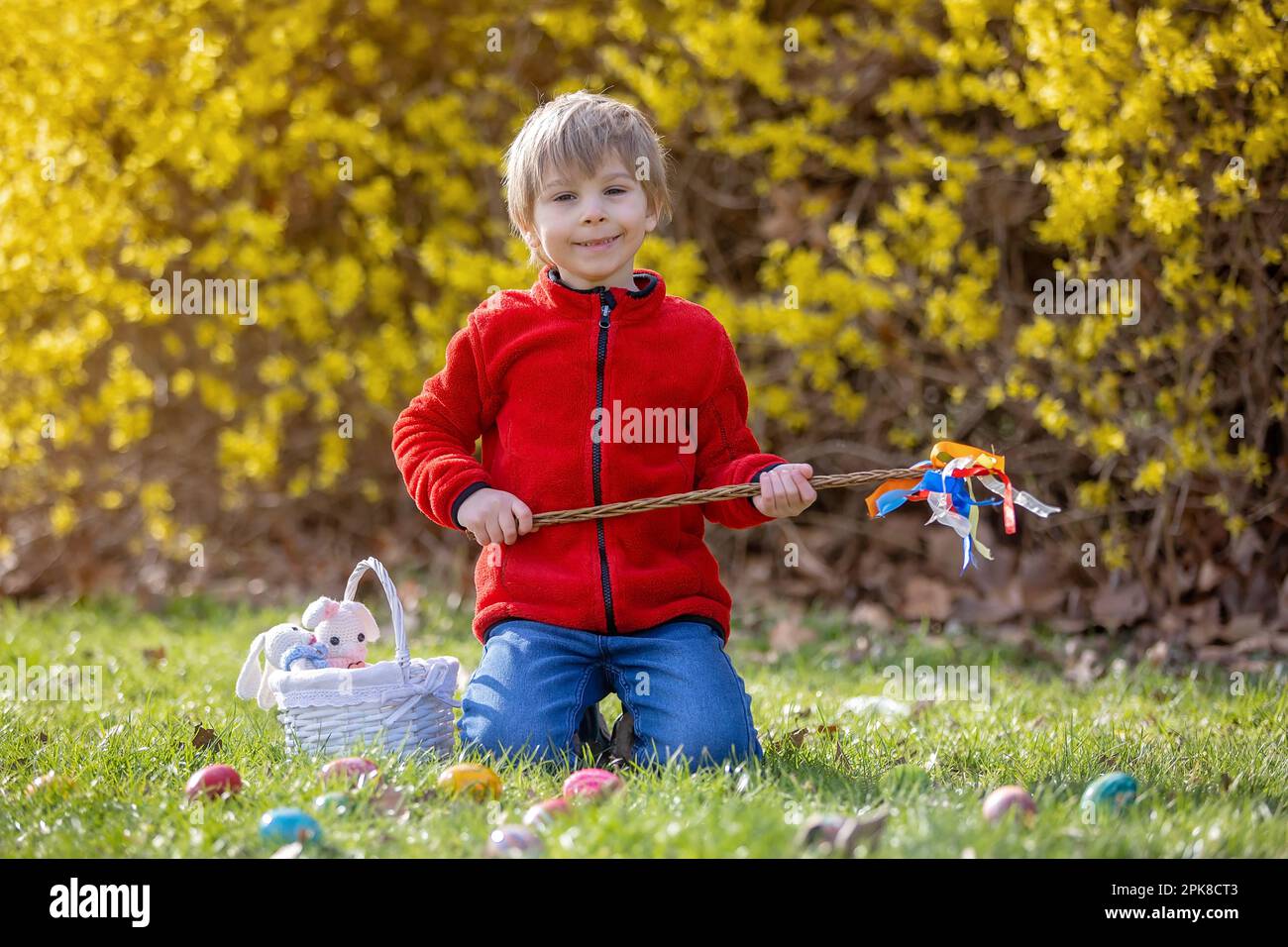 Cute preschool child, boy, holding handmade braided whip made from ...