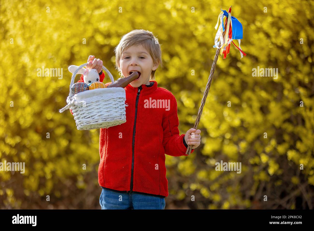 Cute preschool child, boy, holding handmade braided whip made from ...