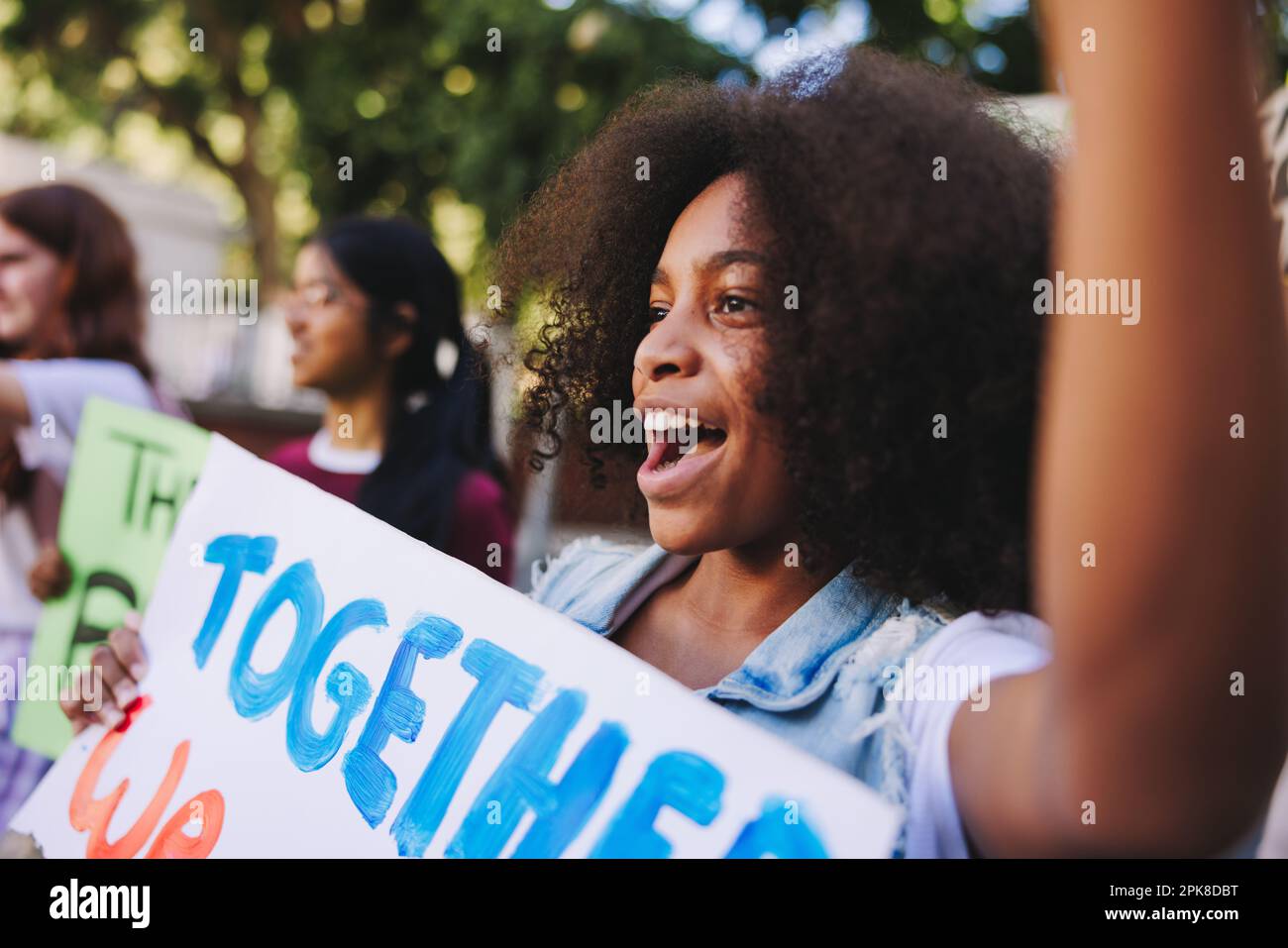 Diverse young people fighting to save the earth. Group of multicultural ...