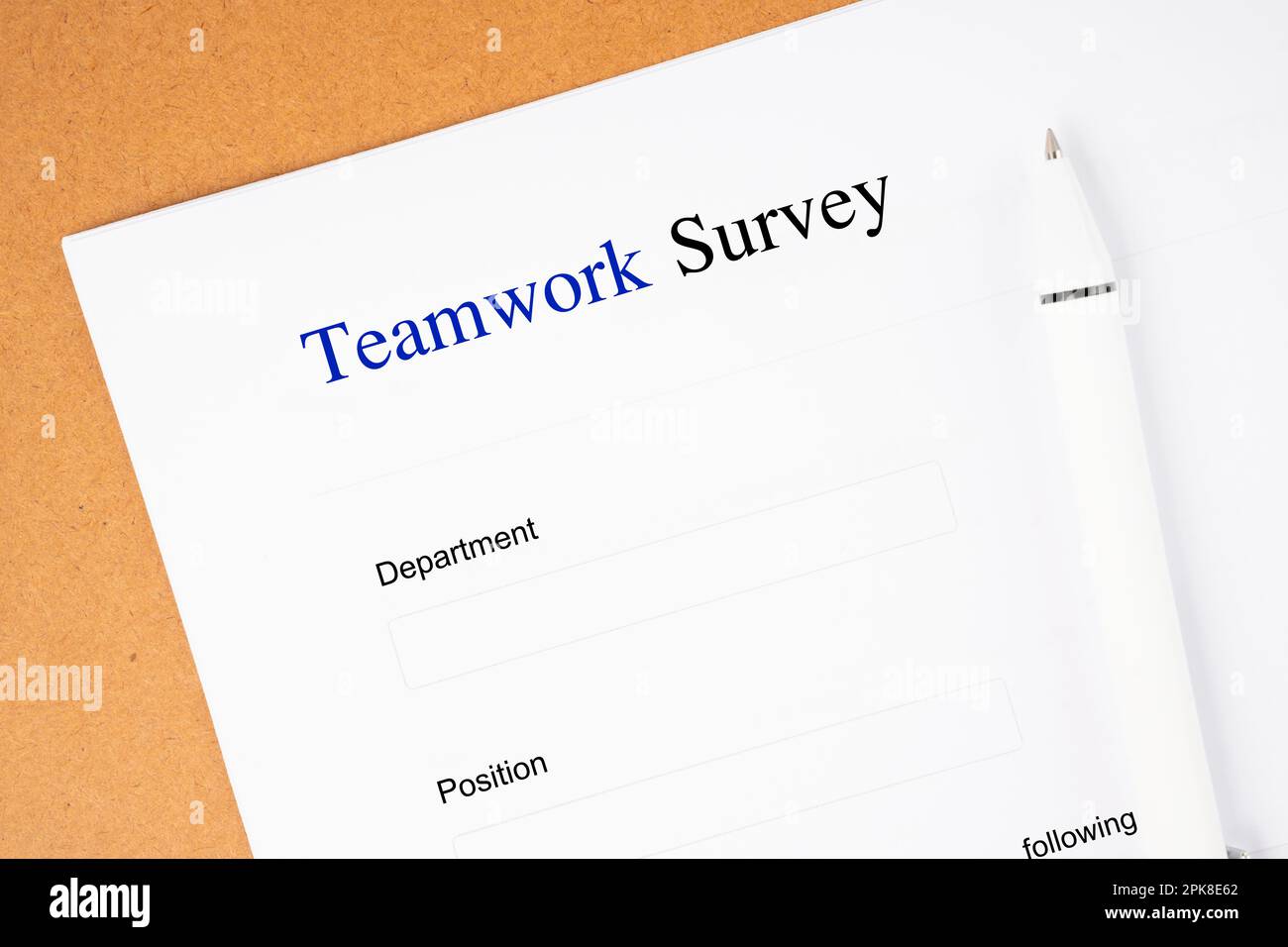Template of an Teamwork survey form document and and pen on wooden ...