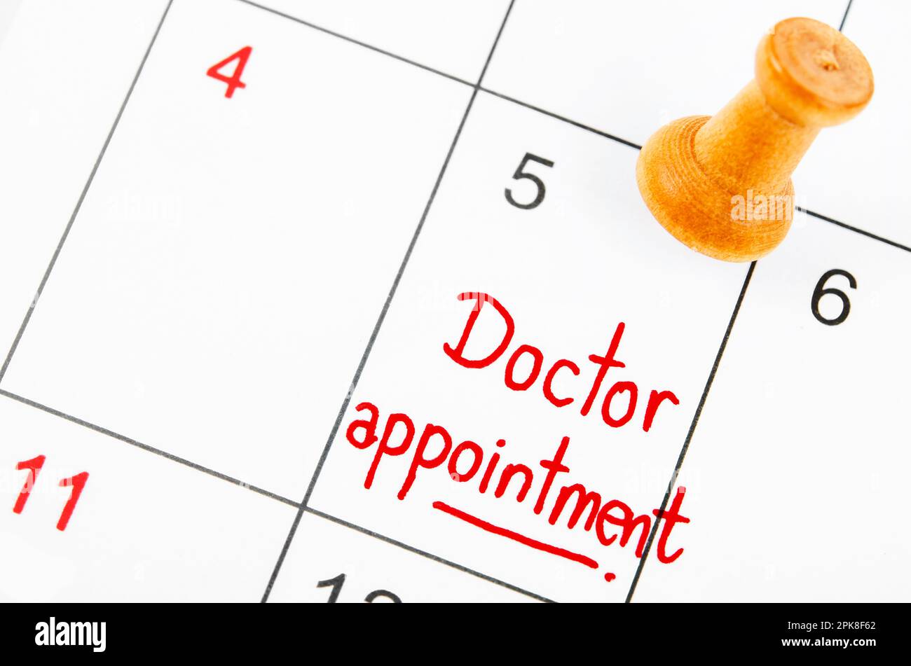 Doctor appointment handwriting on calendar and wooden push pin Stock ...