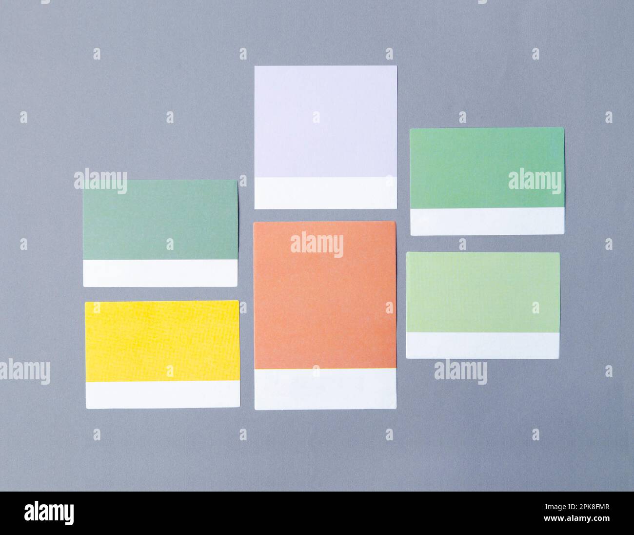 Colorful blank notes adhesives paper for your text or message on grey ...