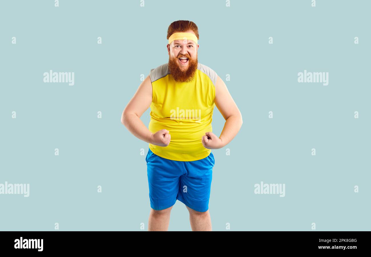 Funny happy excited fat guy having sports workout, doing exercises and ...