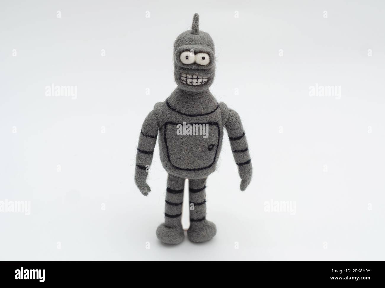 Felted toy made of wool. Robot Bender on white background Stock Photo ...